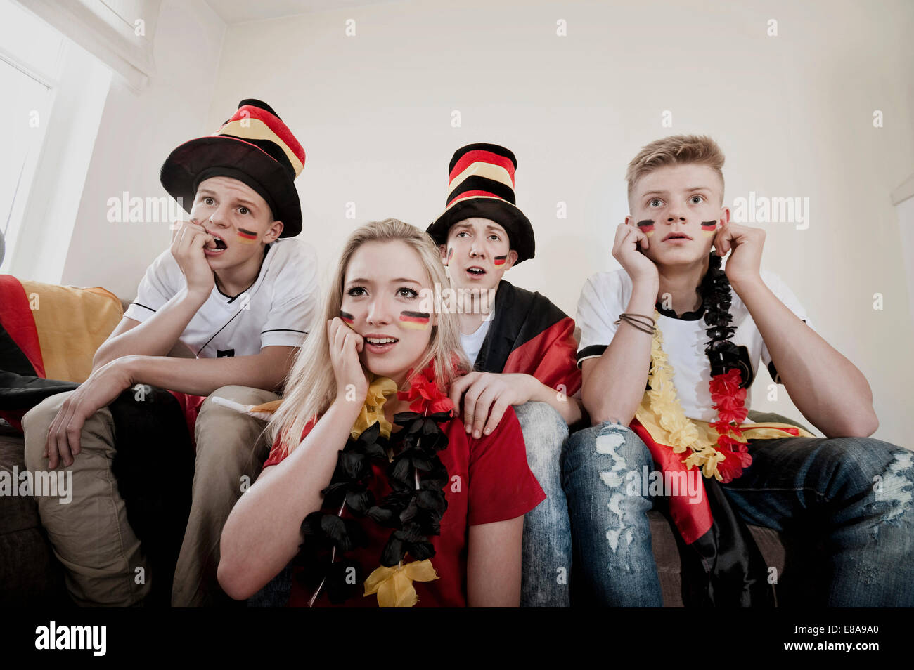 Teenage soccer fans watching TV Stock Photo - Alamy