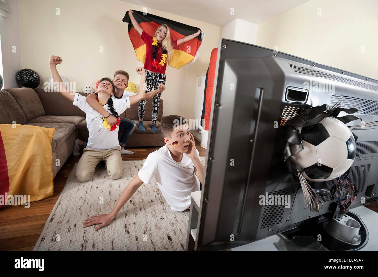 Teenage soccer fans watching TV Stock Photo - Alamy