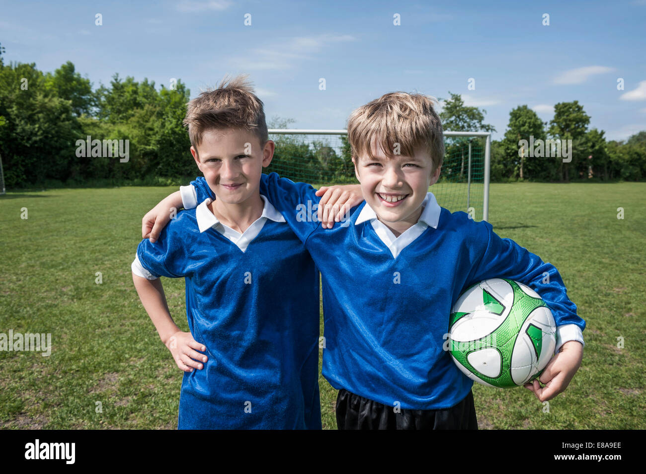 Friends boys young football players portrait Stock Photo - Alamy