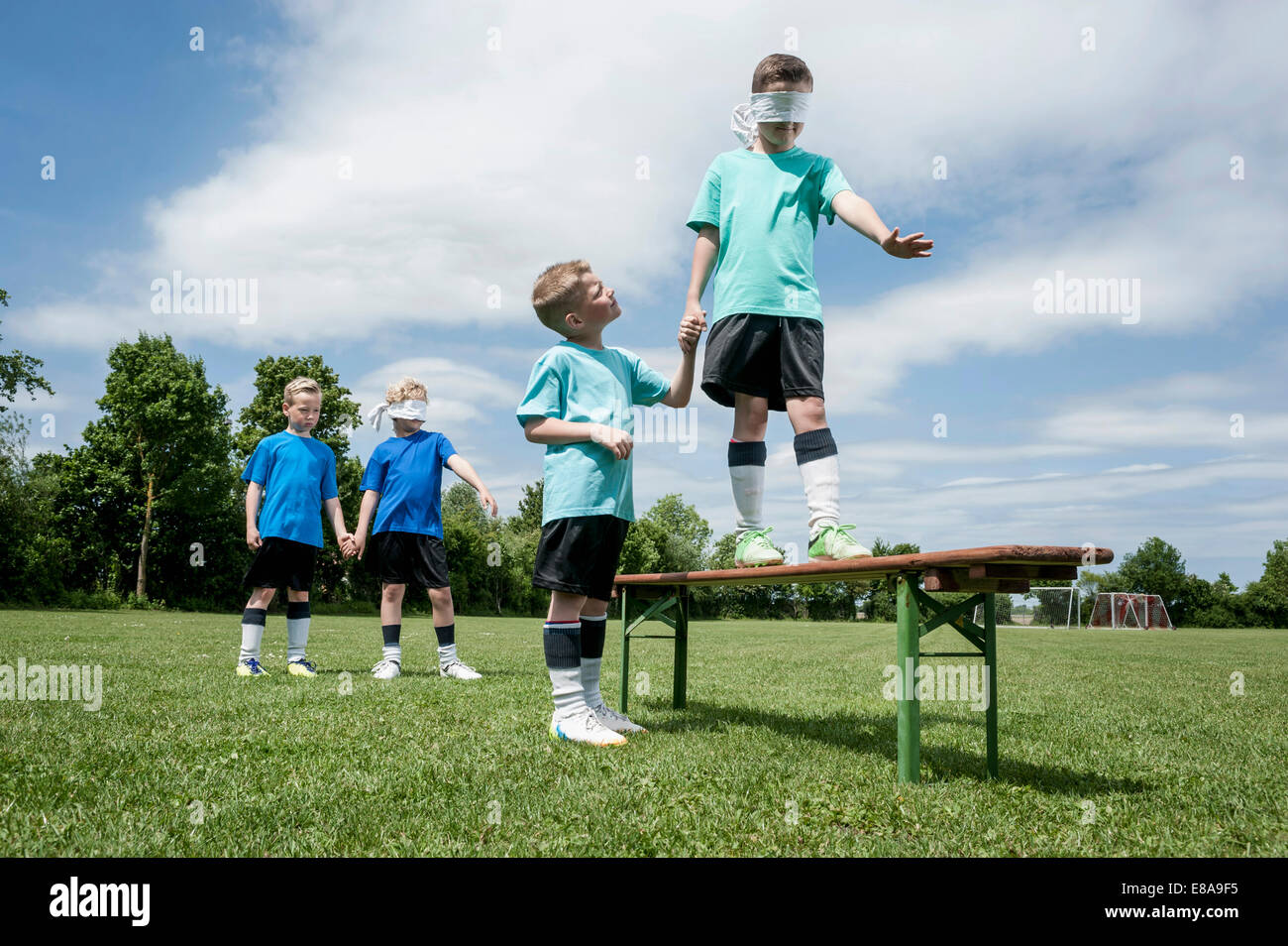 Young football players learning trust courage Stock Photo - Alamy