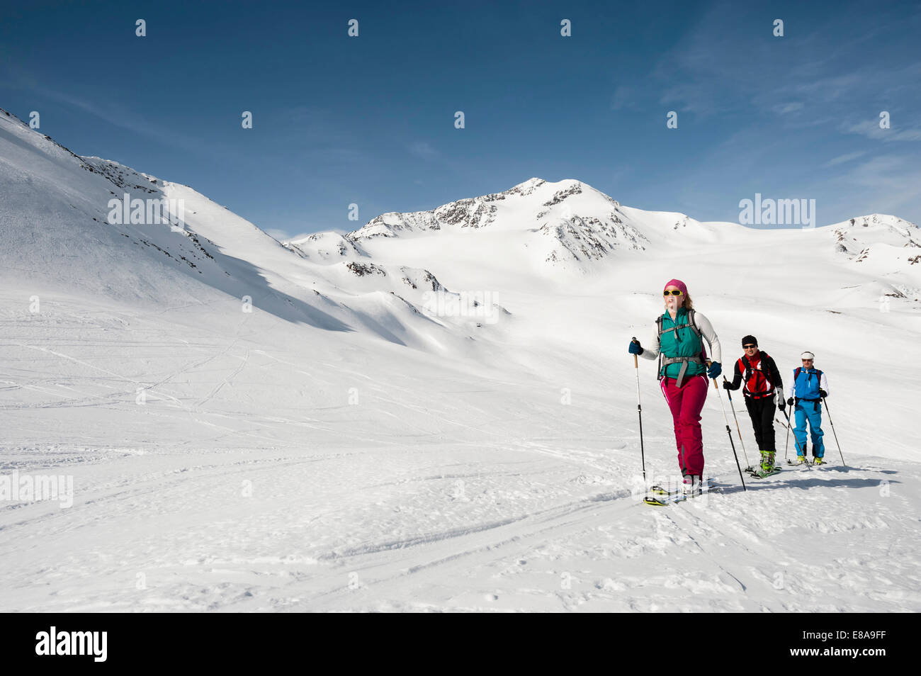 Cross-country skiing group three people snow Stock Photo - Alamy