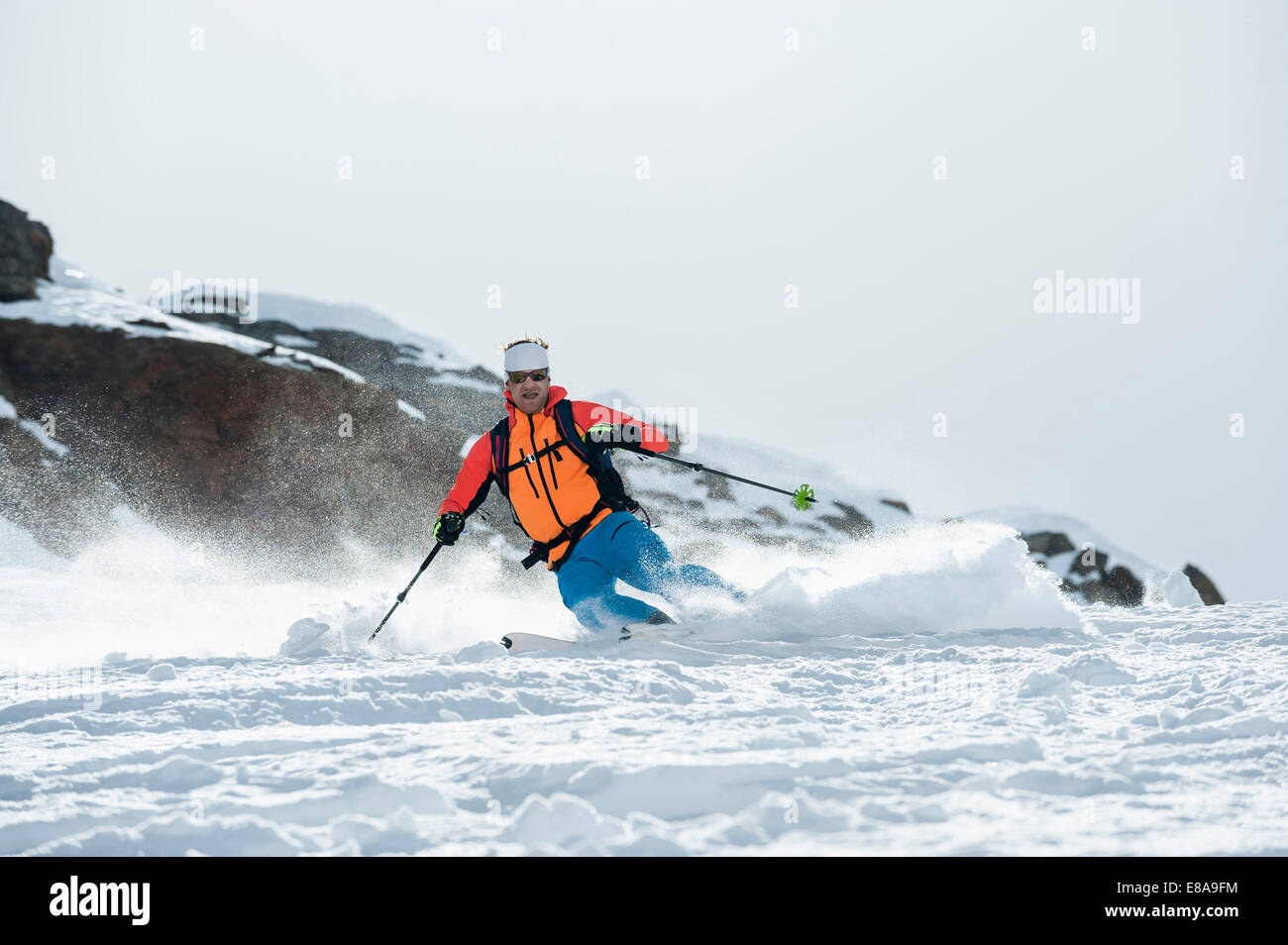 Man skiing downhill powder snow Alps Stock Photo - Alamy
