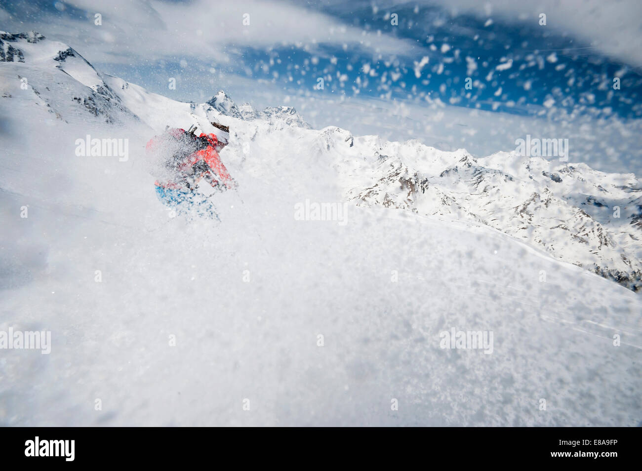 Skier woman downhill powder snow Alps Stock Photo - Alamy