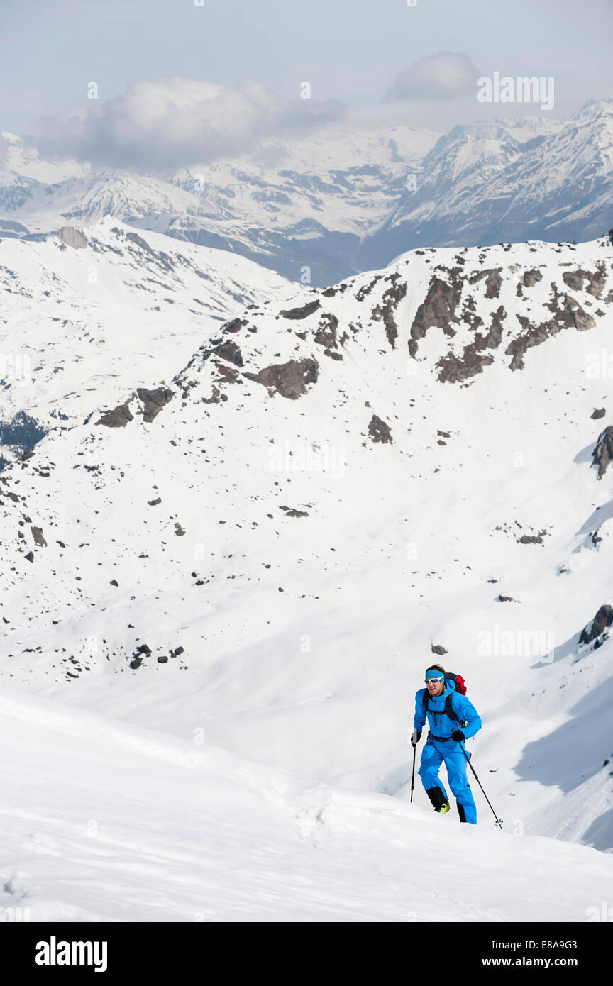 Man climbing mountain Alps snow winter Stock Photo - Alamy