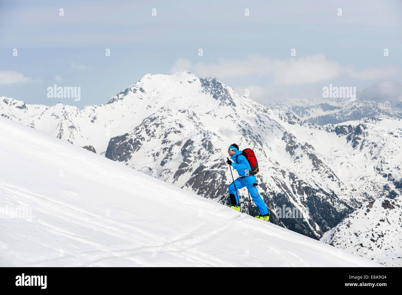 Man climbing mountain Alps snow winter Stock Photo - Alamy