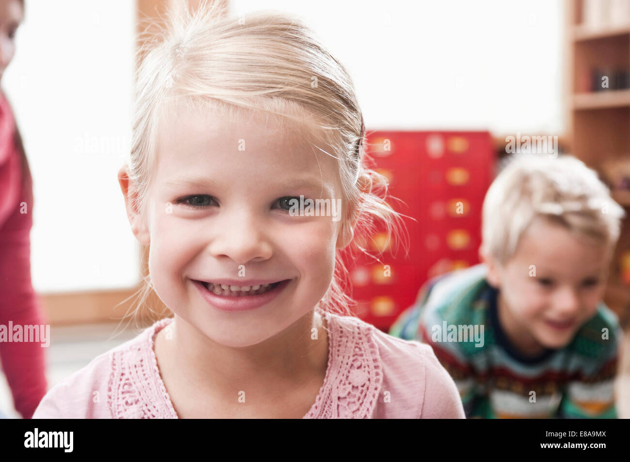 Portrait of smiling little girl in kindergarten Stock Photo - Alamy