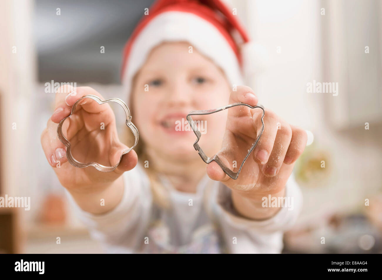 Girl with cookie cutter, close up Stock Photo - Alamy