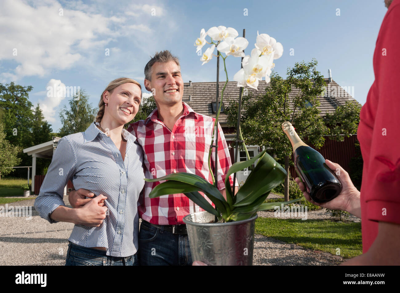 Neighbour new owners house greeting present Stock Photo - Alamy