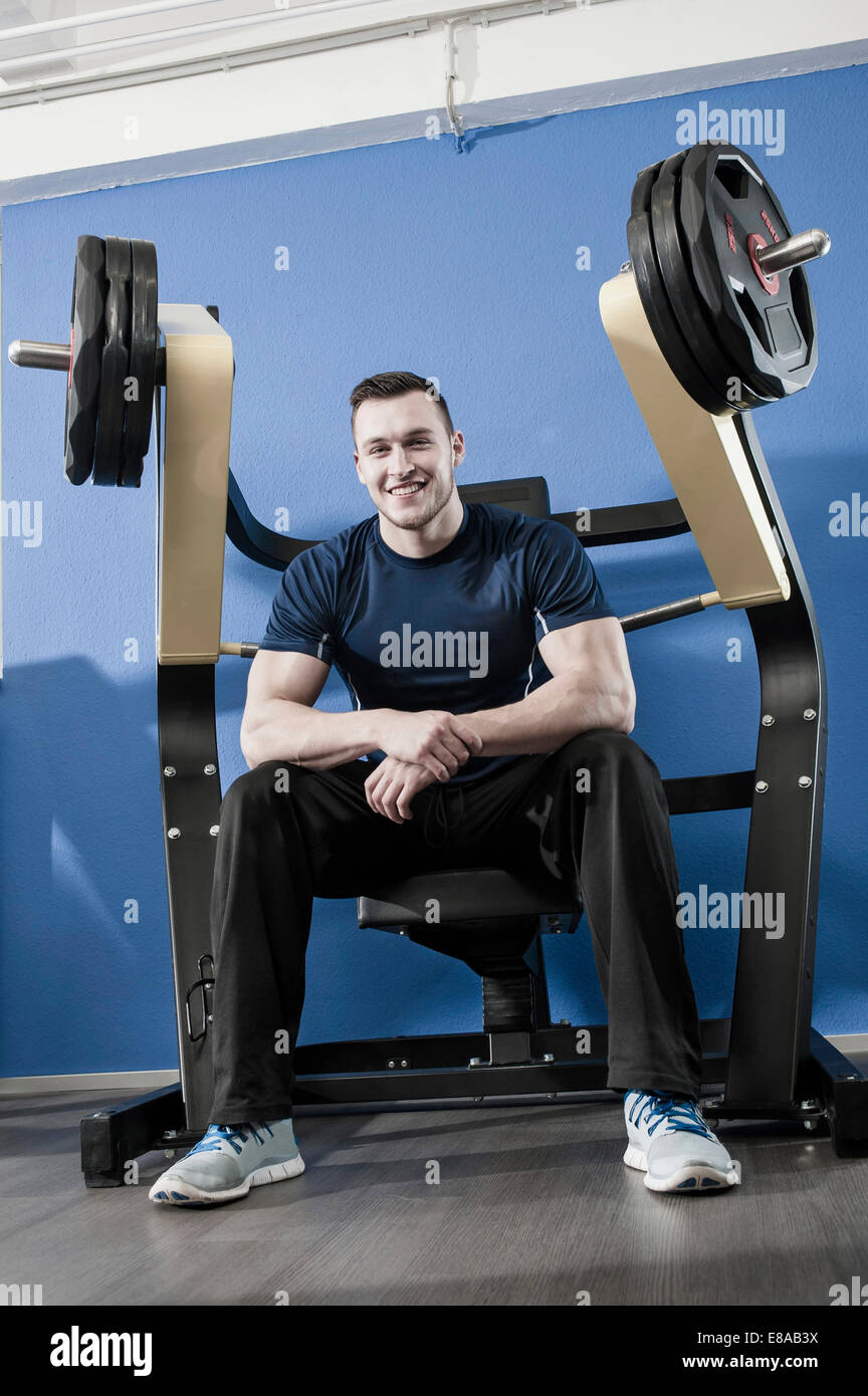 Smiling young man in gym Stock Photo - Alamy