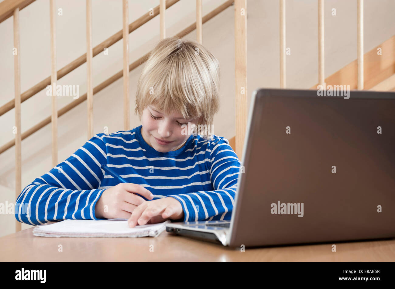 Boy doing his homework Stock Photo - Alamy