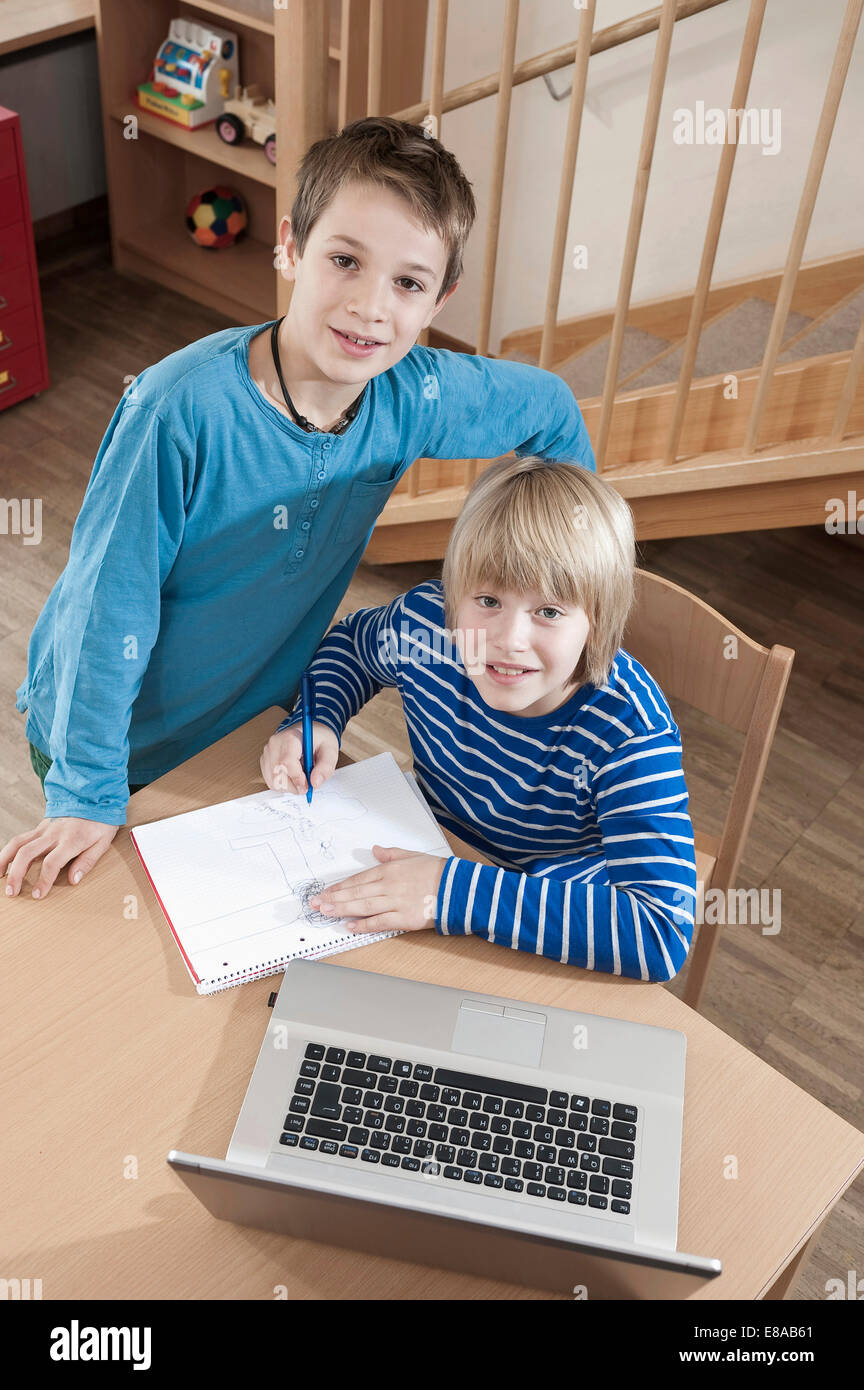 Two boys with homework Stock Photo - Alamy