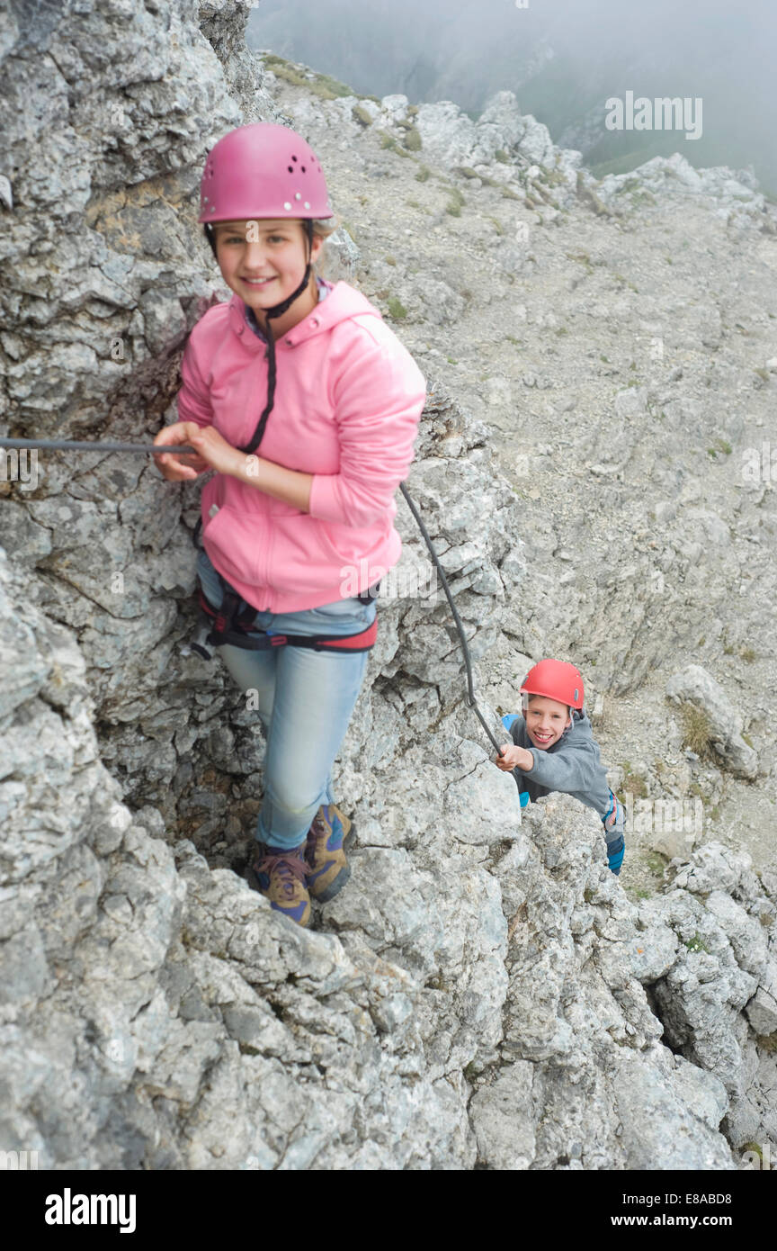 Young teenage girl holding rope mountain climbing Stock Photo - Alamy