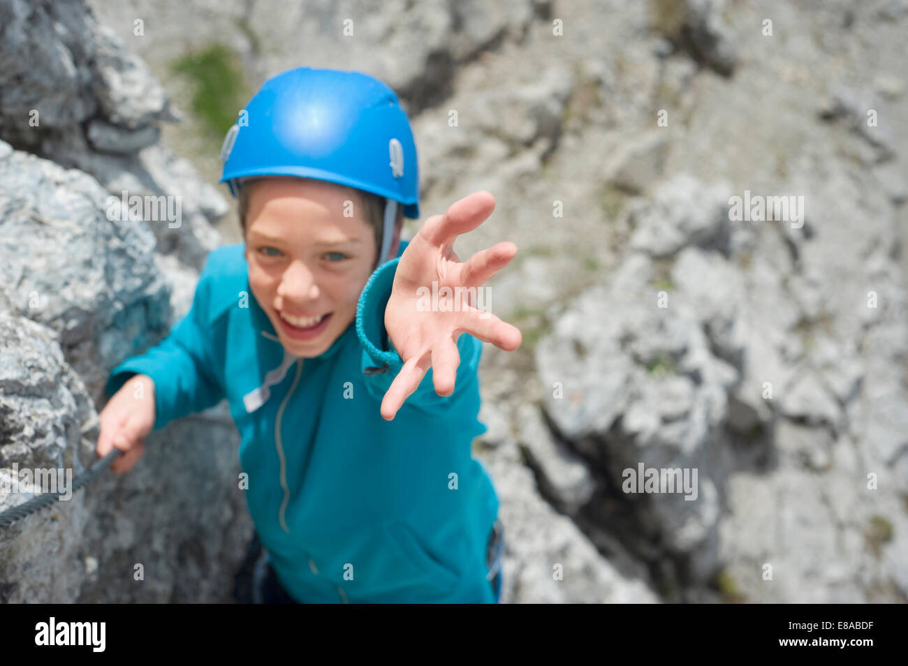 Teenager climbing Alps mountains reaching helping Stock Photo - Alamy