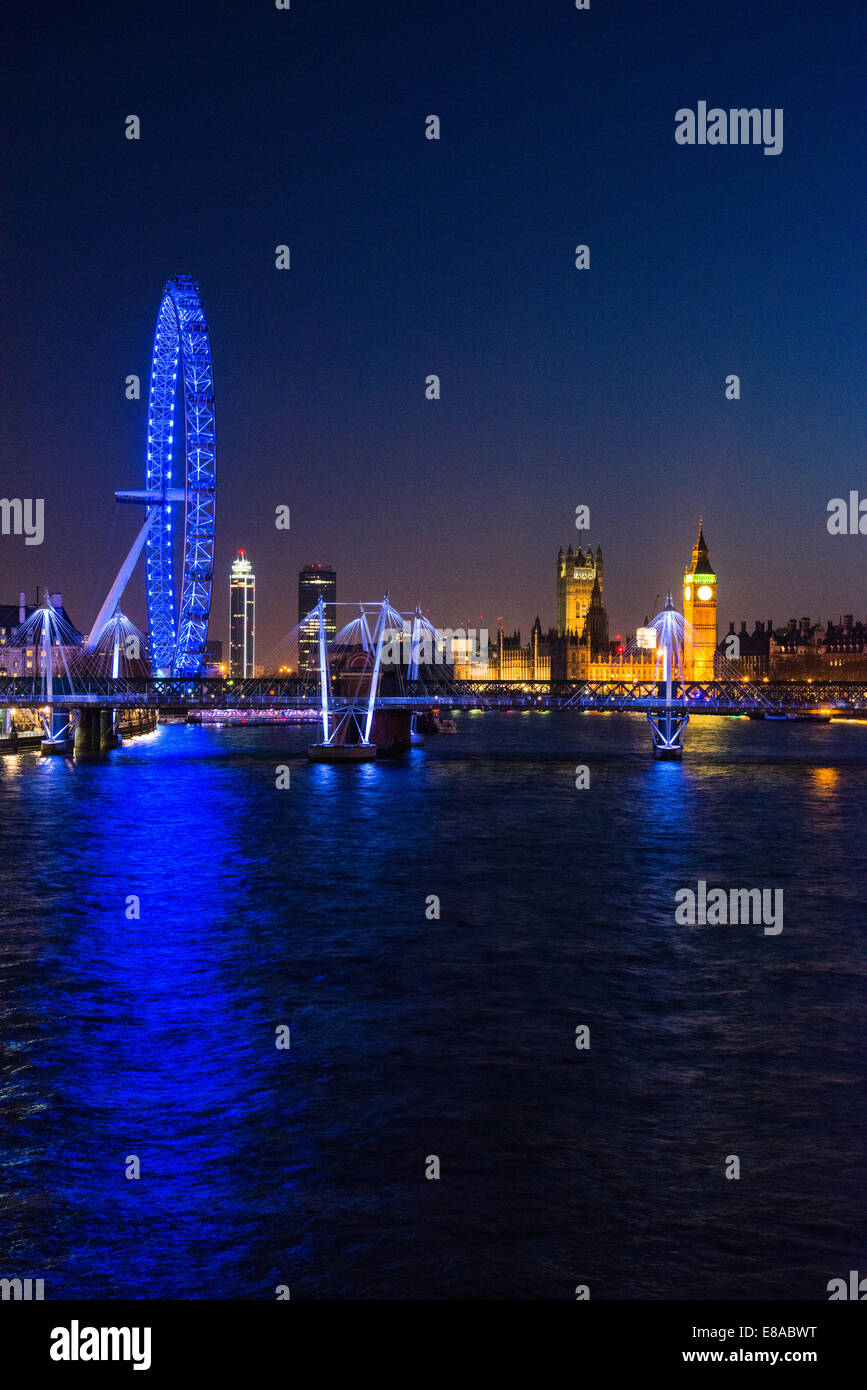 View at dusk towards The London Eye, The Palace of Westminster ...