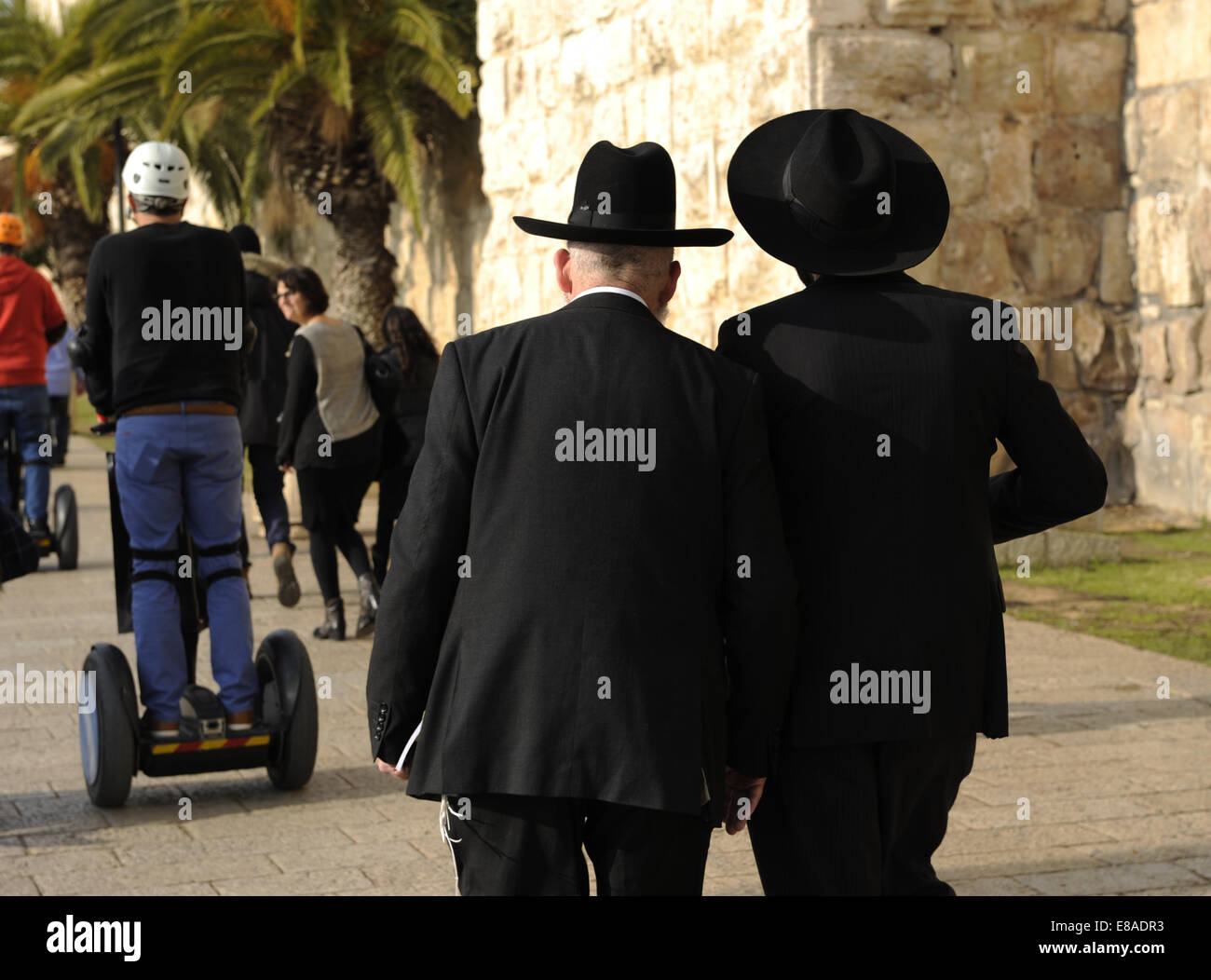 Israel. Jerusalem. Jews walking by the old city walls Stock Photo - Alamy