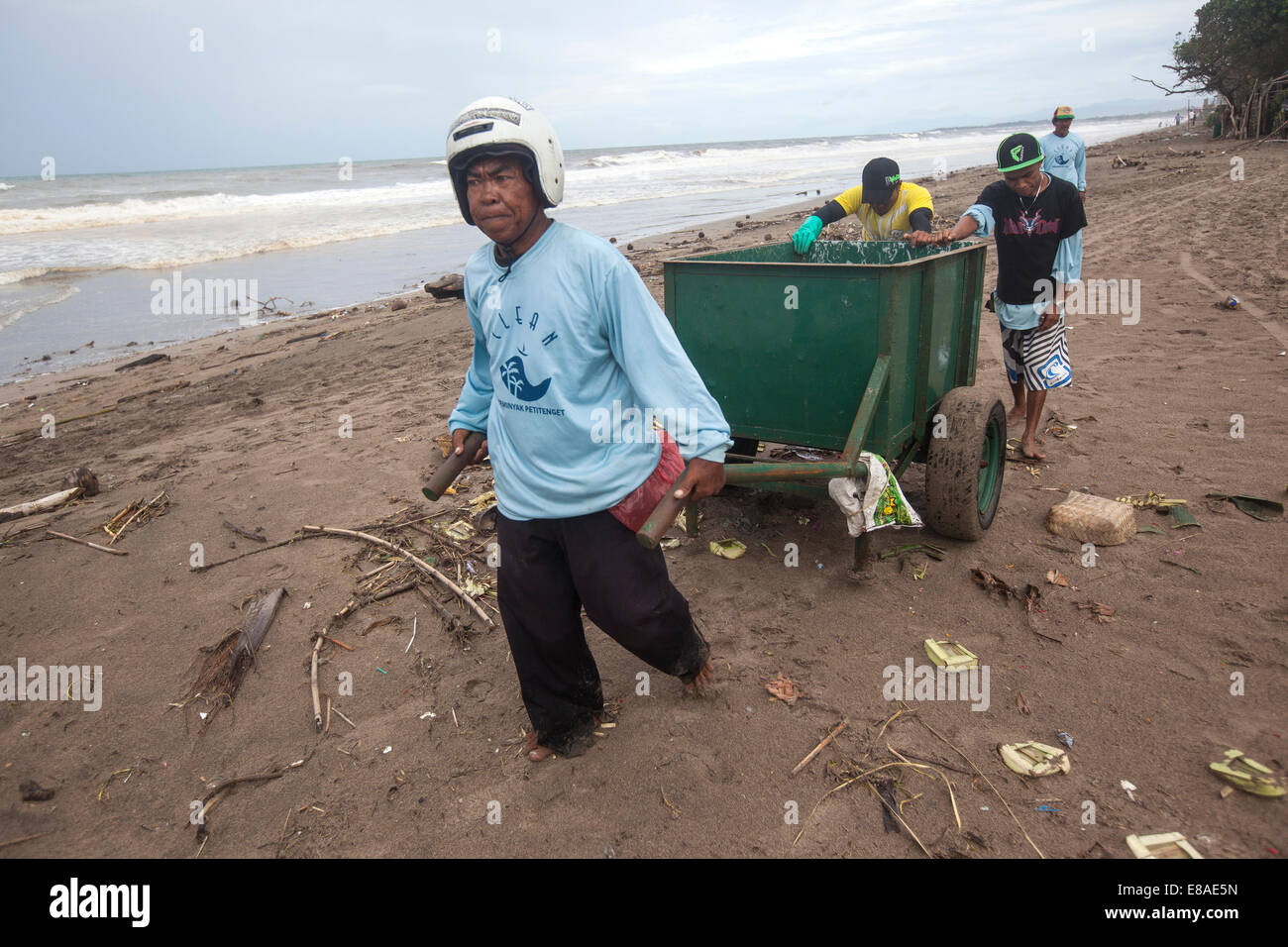 Asian people collecting garbage on beach Stock Photo - Alamy