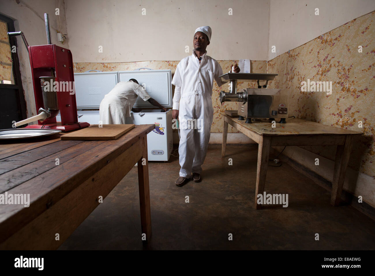 Entrepreneurial butcher poses in his meat processing room, Kigali ...