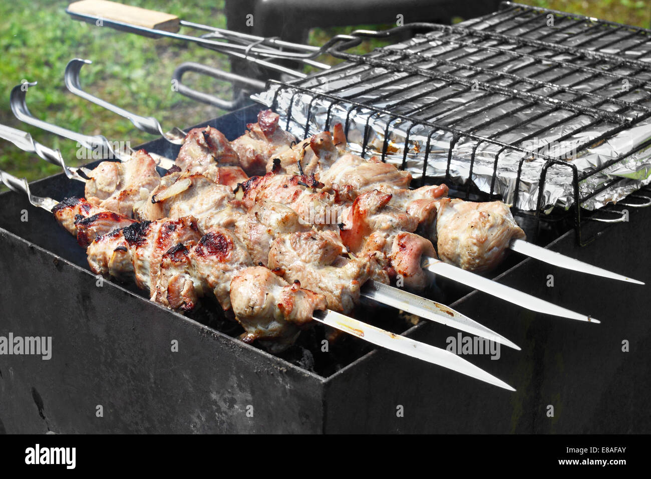 Kebab and barbecue on grill outdoor closeup Stock Photo - Alamy