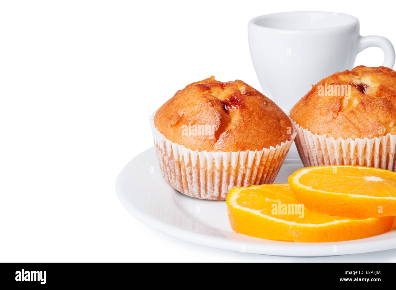 Two muffins and orange slices on a white background Stock Photo - Alamy