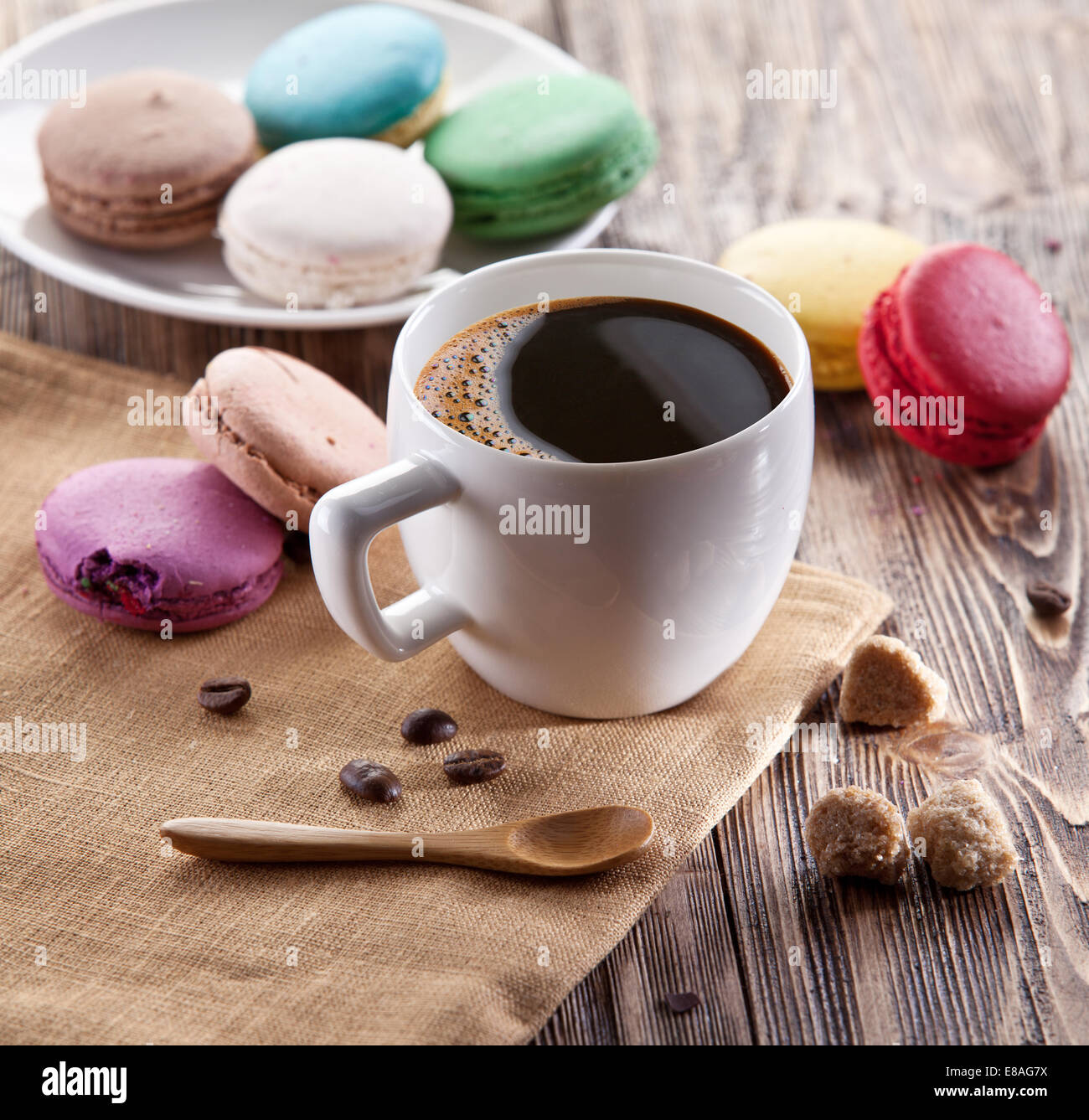 Cup of coffee and french macaron on an old wooden table Stock Photo - Alamy