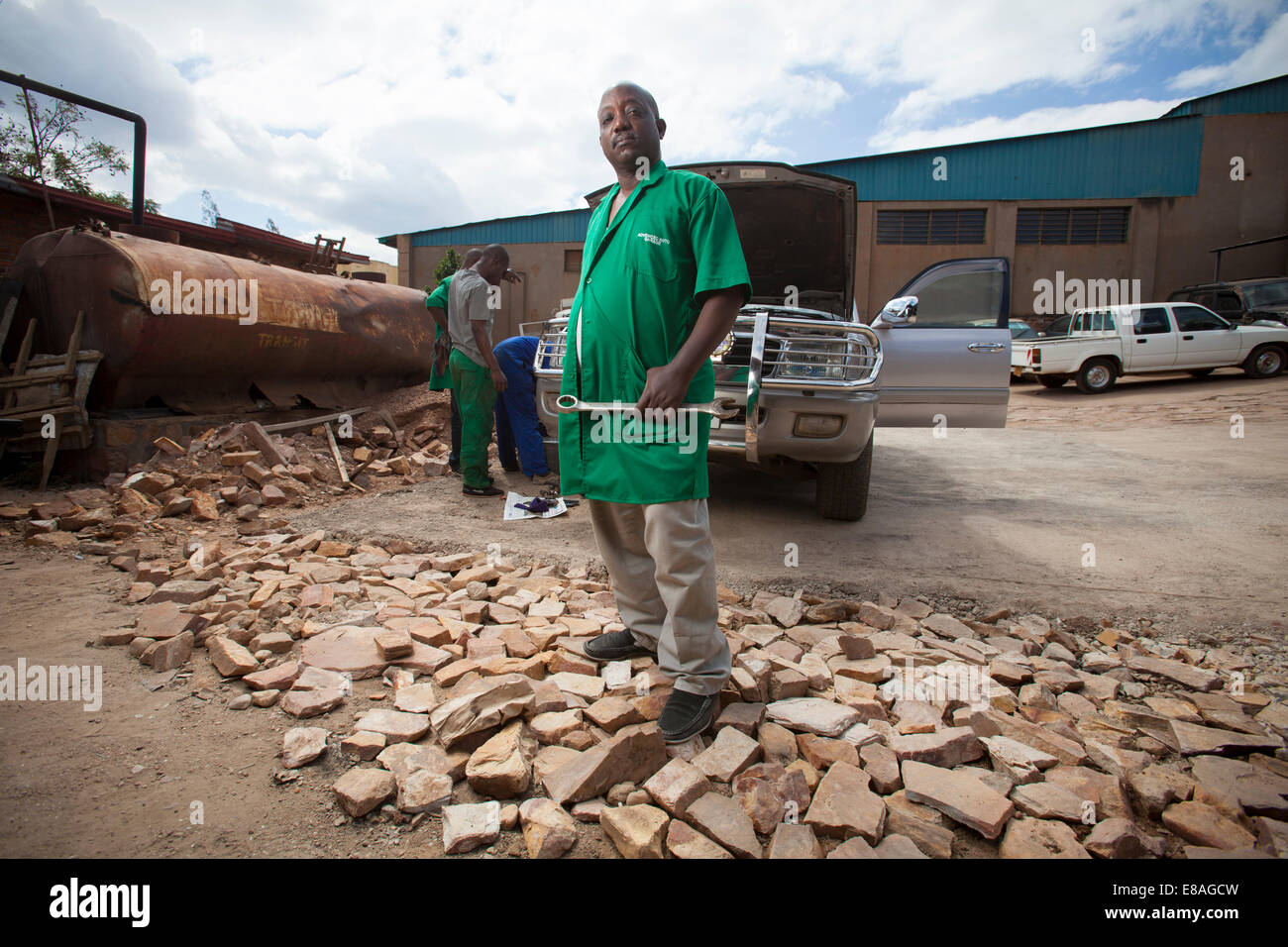 Rwandan mechanic and entrepreneur poses at his garage, Kigali, Rwanda ...