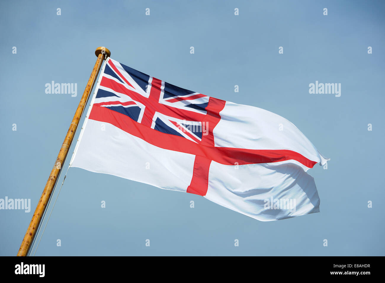 Royal Ensign flag flying in the wind against a blue sky Stock Photo - Alamy