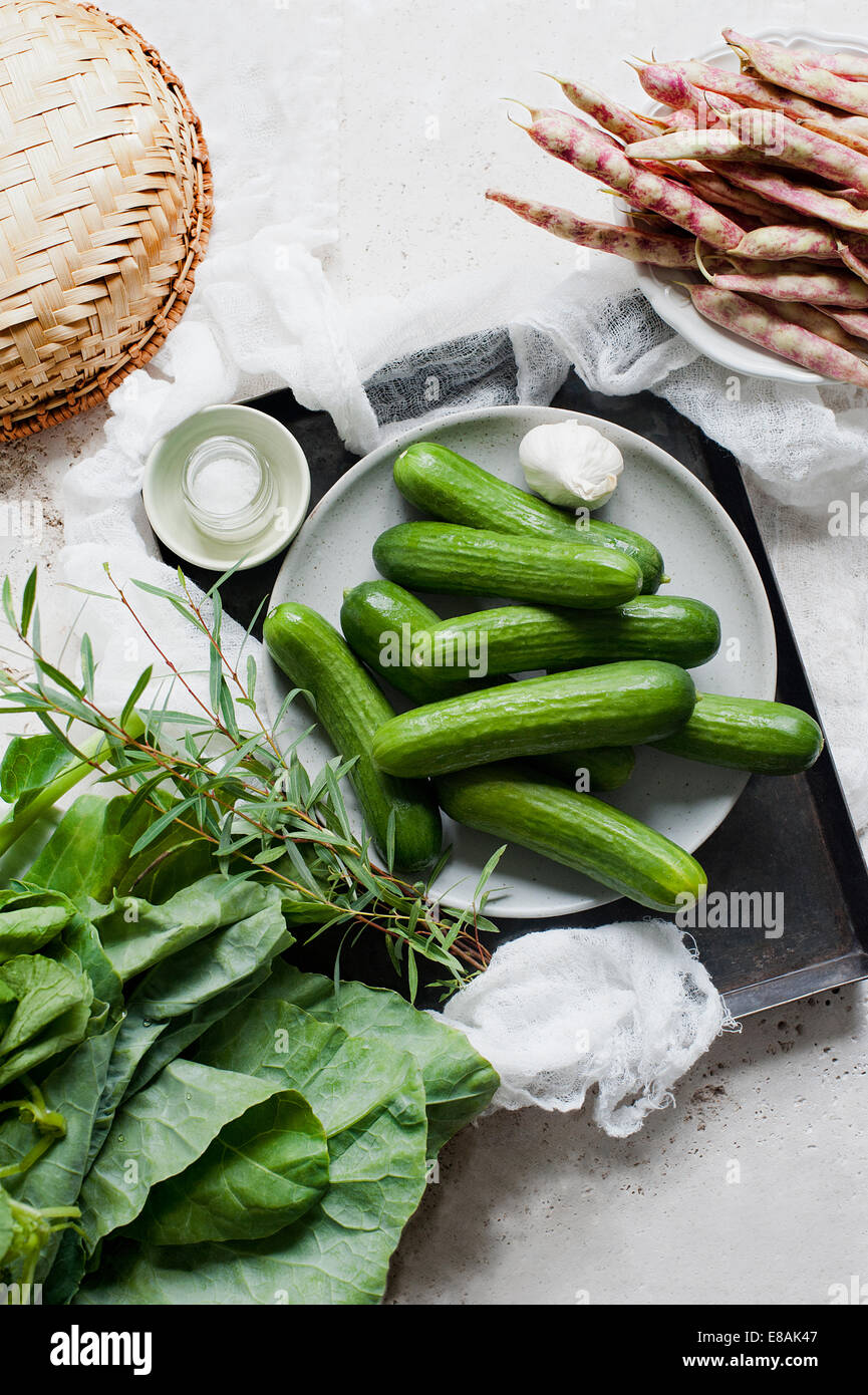 Cucumbers, beans and leaves, still life Stock Photo - Alamy