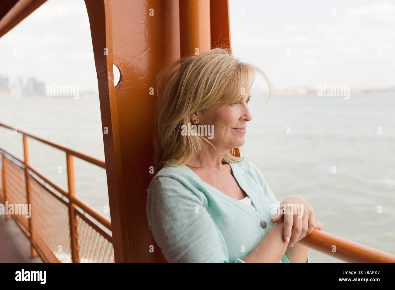 Mature woman on passenger ferry Stock Photo - Alamy