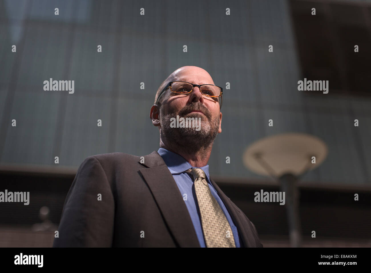 Mature businessman, low angle portrait Stock Photo - Alamy