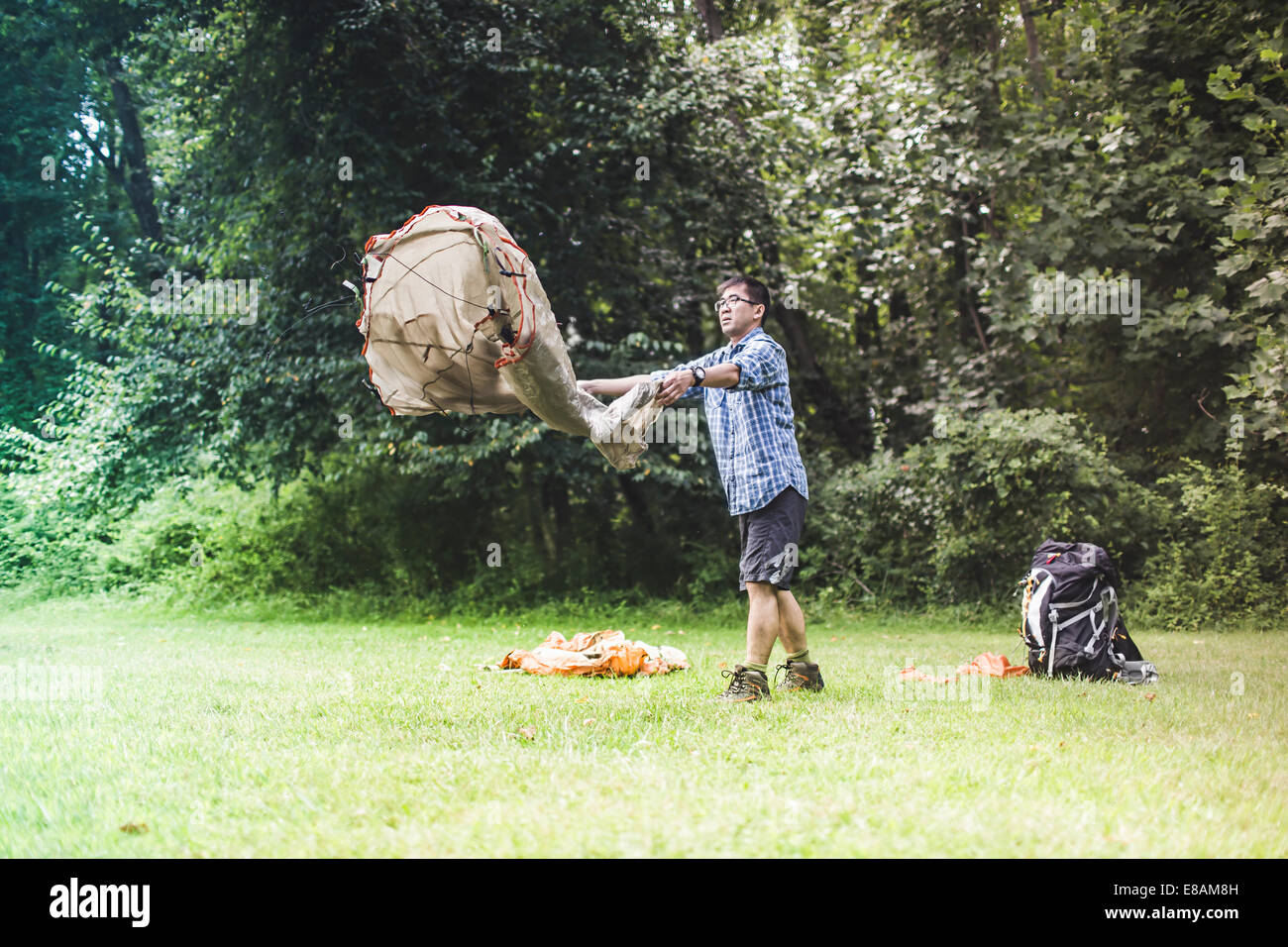 Man putting up hi-res stock photography and images - Alamy