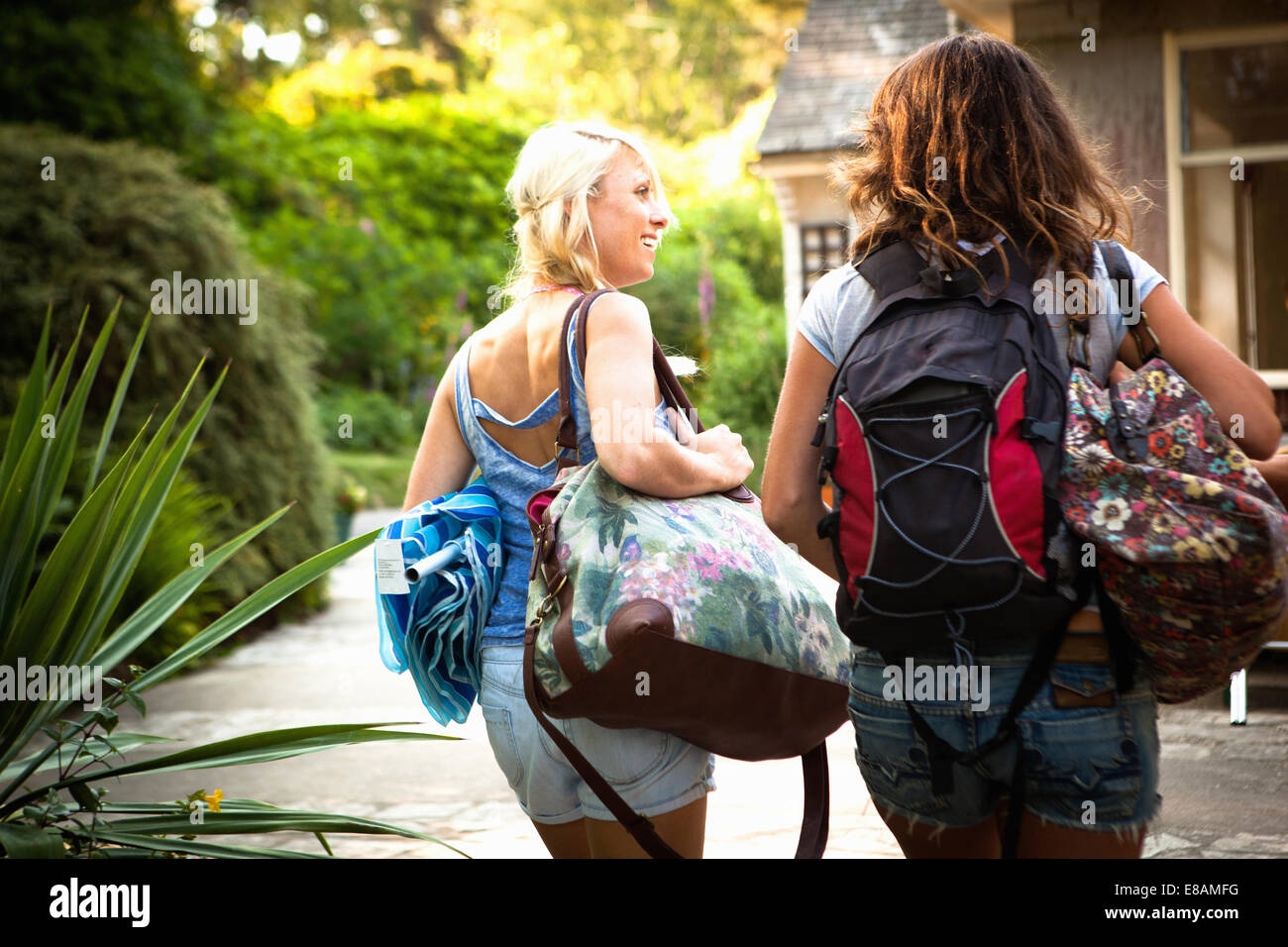 Rear view walking carrying t shirt hi-res stock photography and images ...