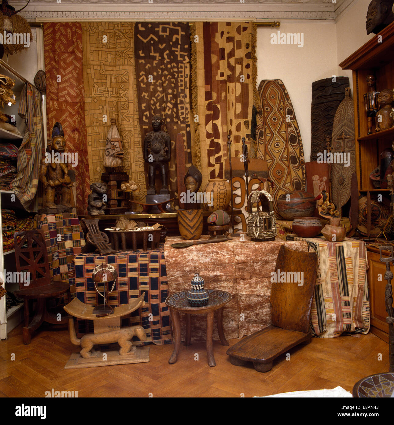 Collection of ethnic artefacts and textiles in shop Stock Photo - Alamy