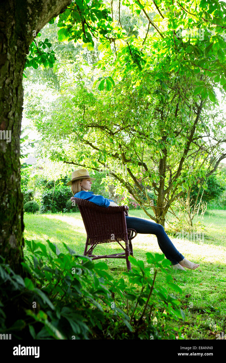 Woman sleeping in chair hi-res stock photography and images - Alamy