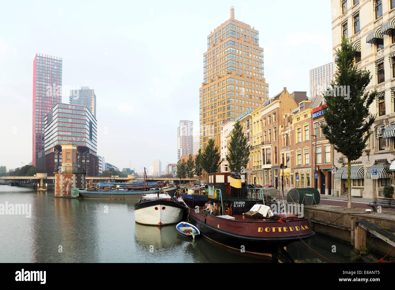 Boat and skyscrapers at the Wijnhaven in Rotterdam, the Netherlands ...