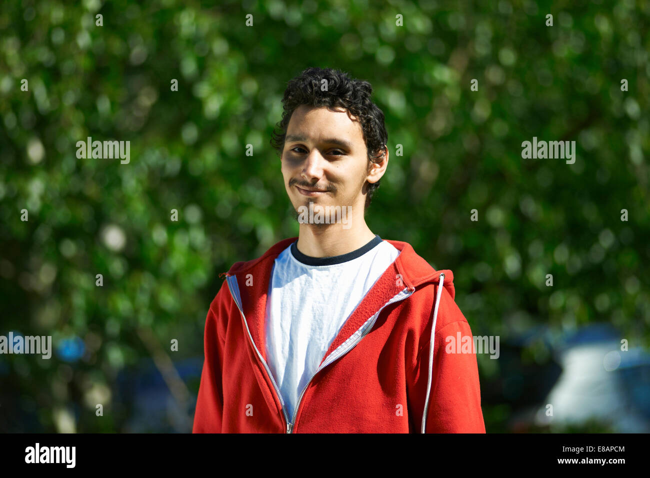 Portrait of young male student outside college Stock Photo - Alamy