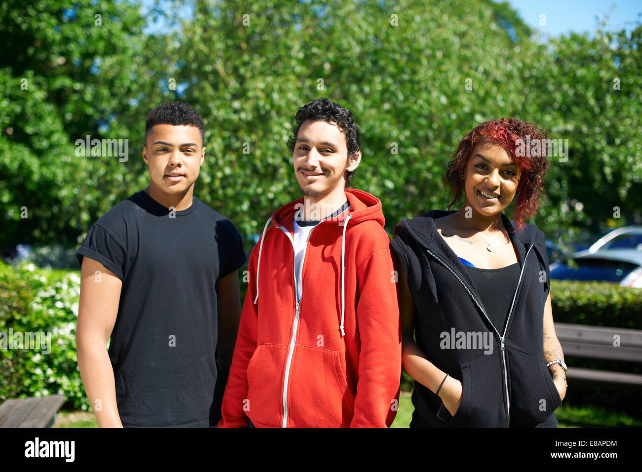 Portrait of three student friends outside college Stock Photo - Alamy