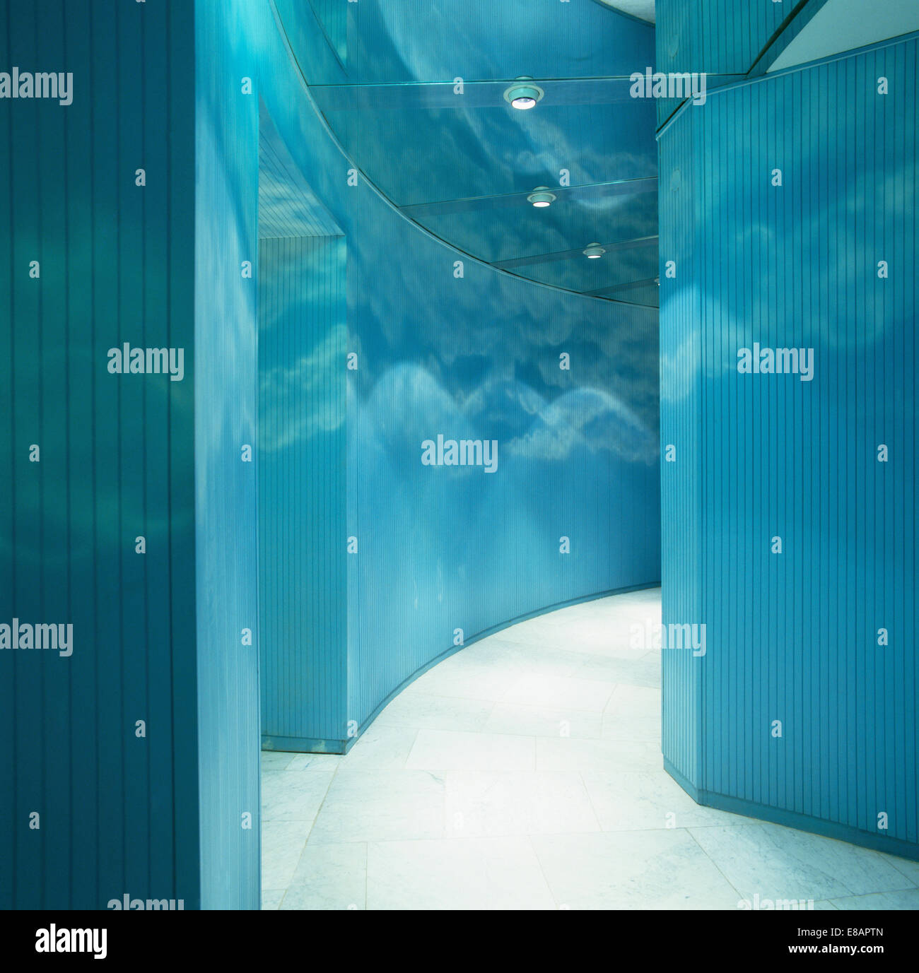 Painted curved, blue panelle walls in office corridor Stock Photo - Alamy