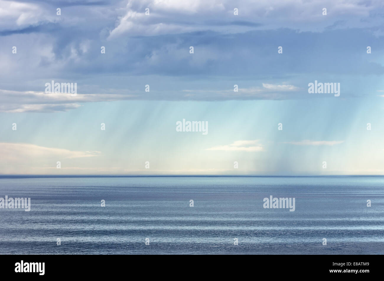 rain over the sea with stormy clouds Stock Photo - Alamy