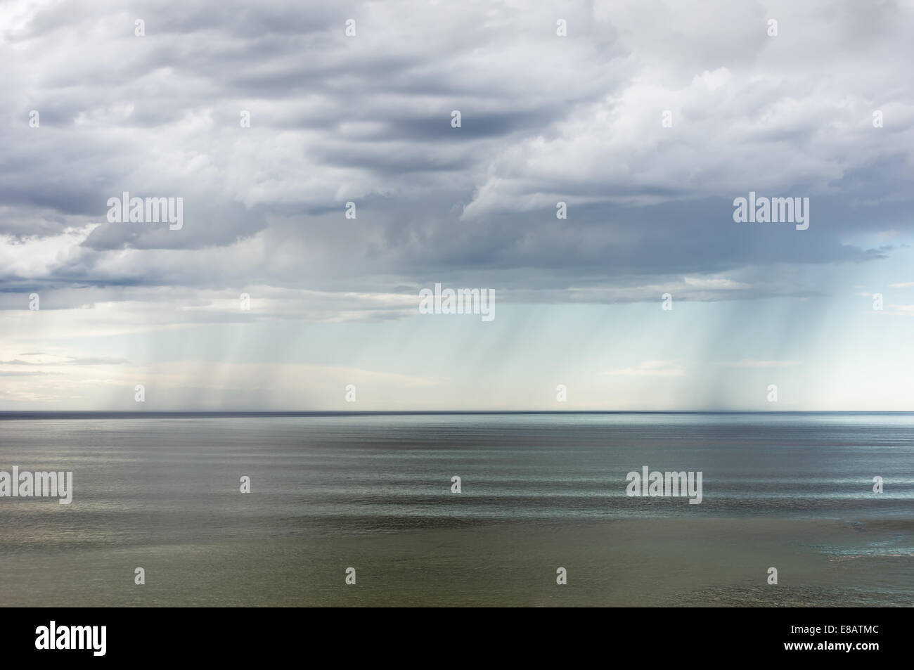 Stormy rain clouds over sea hi-res stock photography and images - Alamy