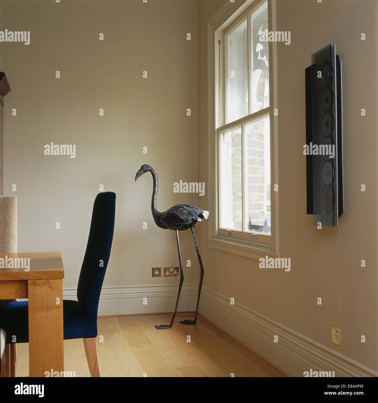 Metal statue of an emu in corner of modern country dining room Stock ...