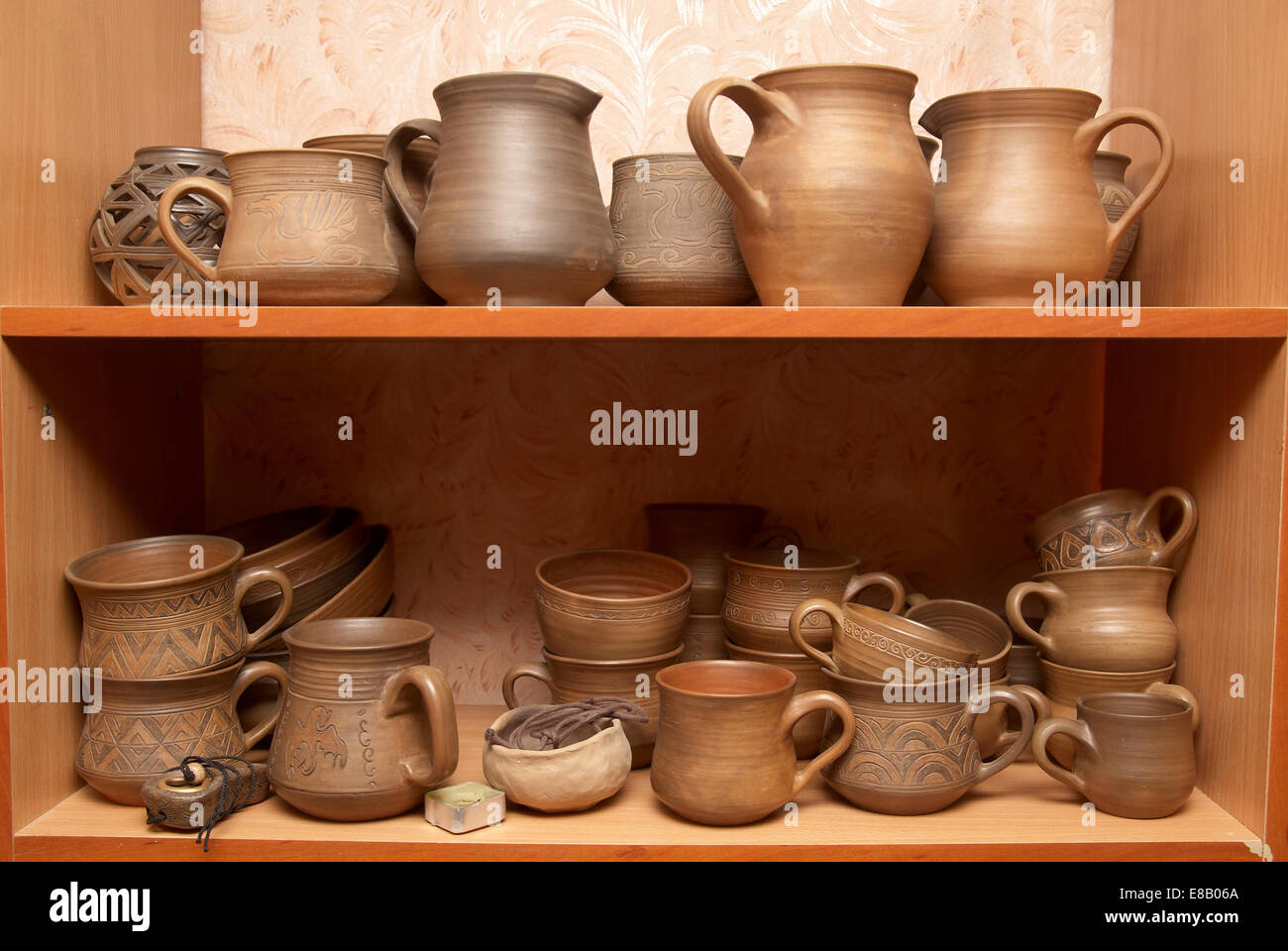 Many handmade old clay pots on the shelf Stock Photo - Alamy