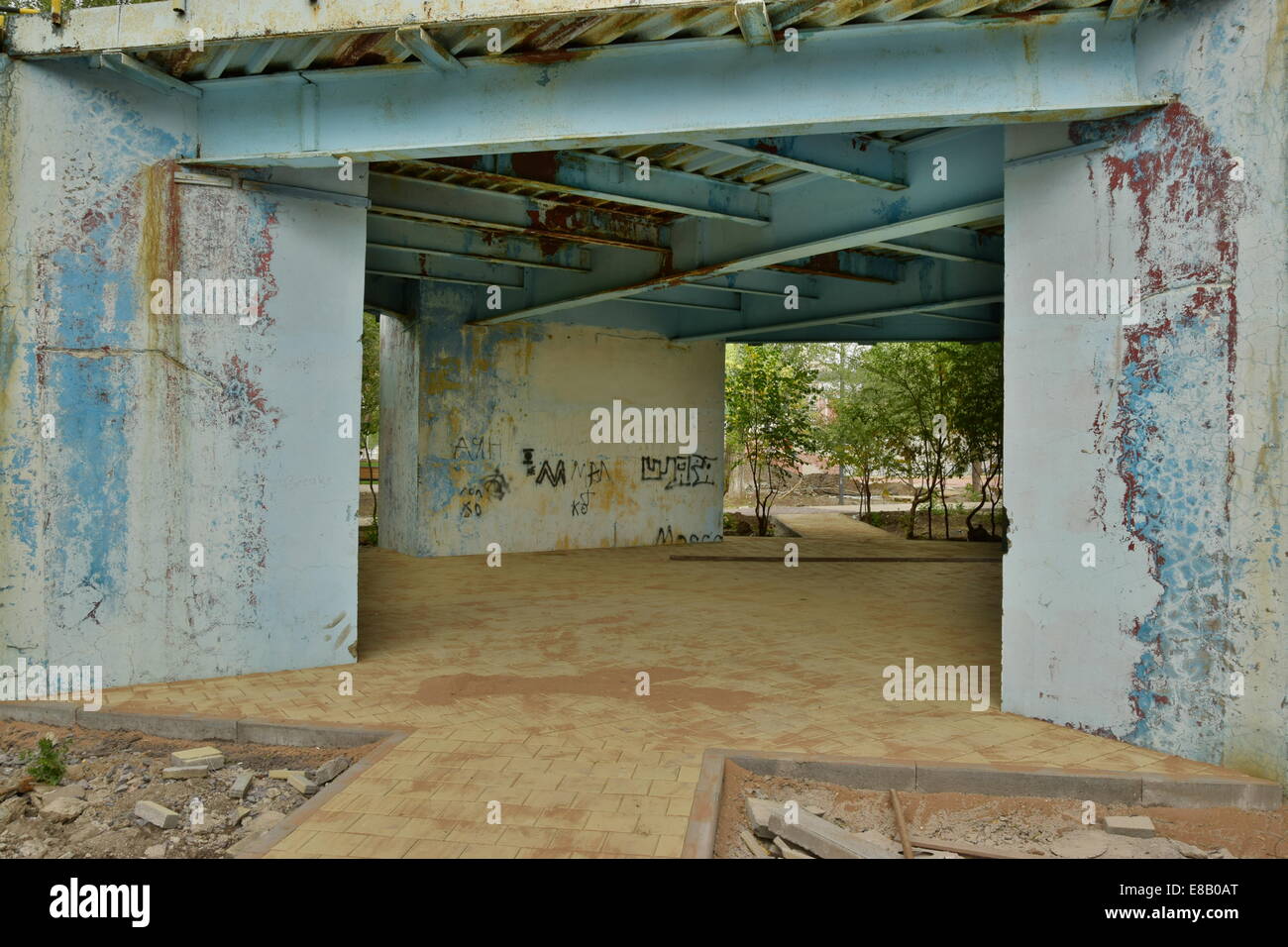A decaying concrete and metal construction painted blue Stock Photo - Alamy