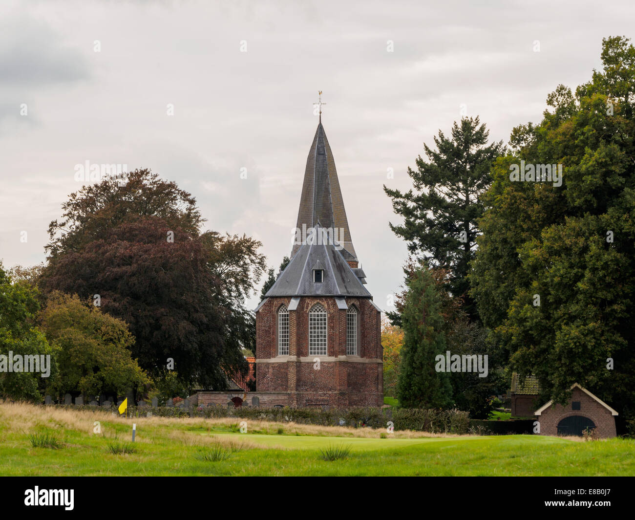 Church behind a green on a golf course Stock Photo - Alamy