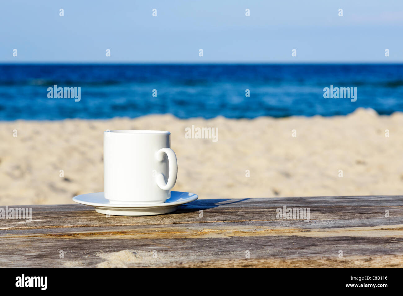 White mug on a table Stock Photo - Alamy