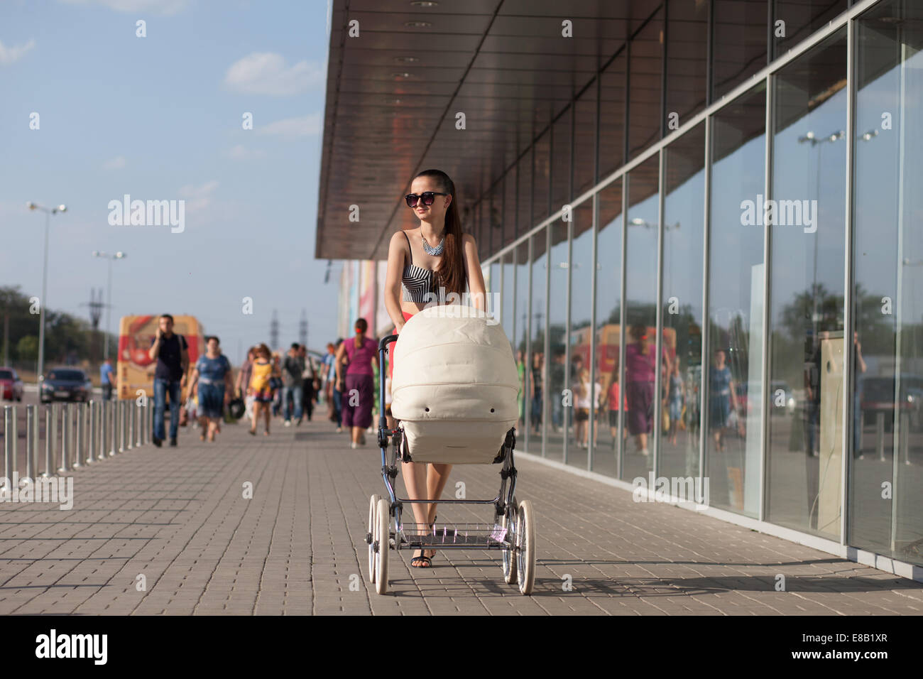 Stylish mom with retro stroller Stock Photo - Alamy