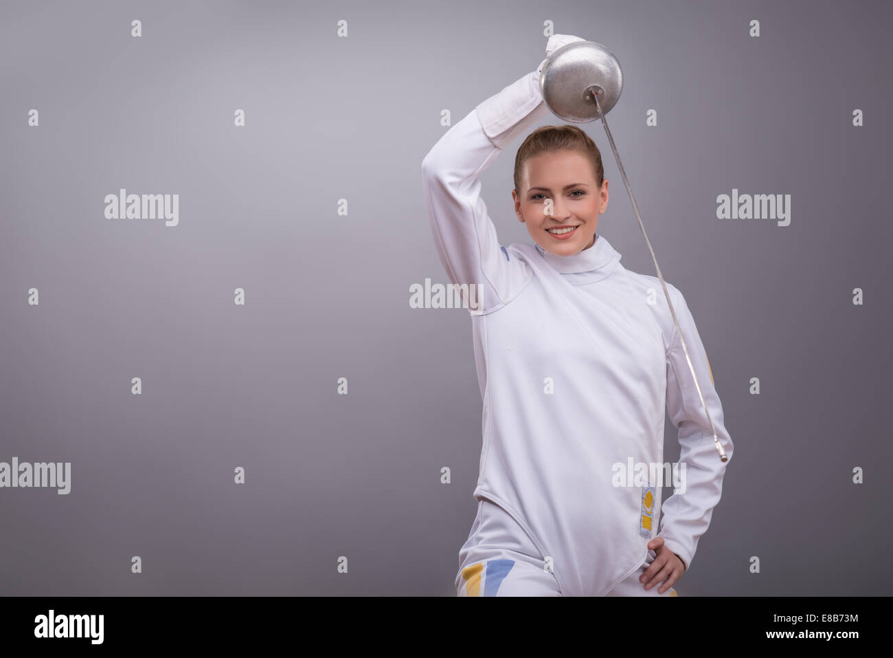 Young woman engaging in fencing Stock Photo - Alamy