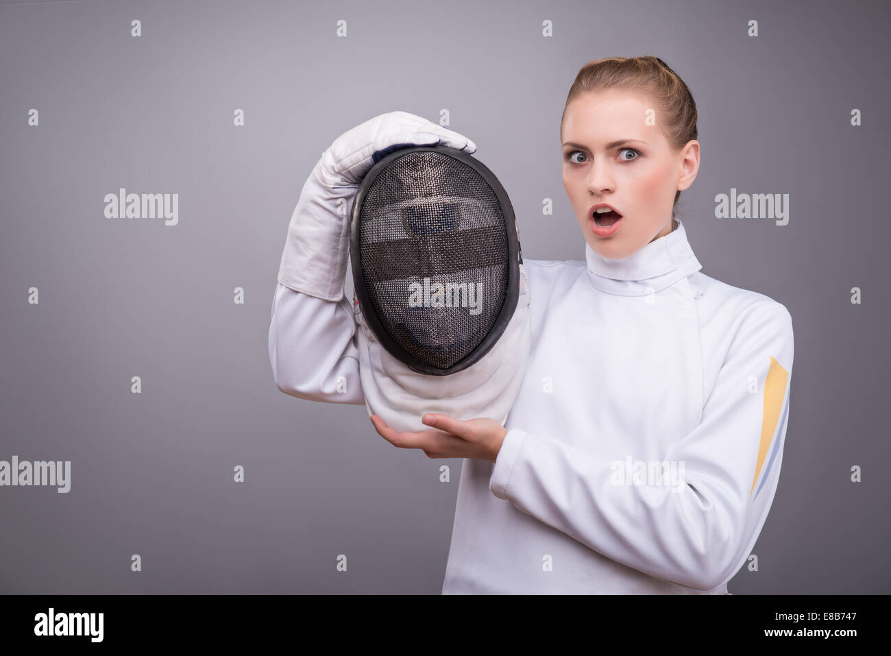 Young woman engaging in fencing Stock Photo - Alamy