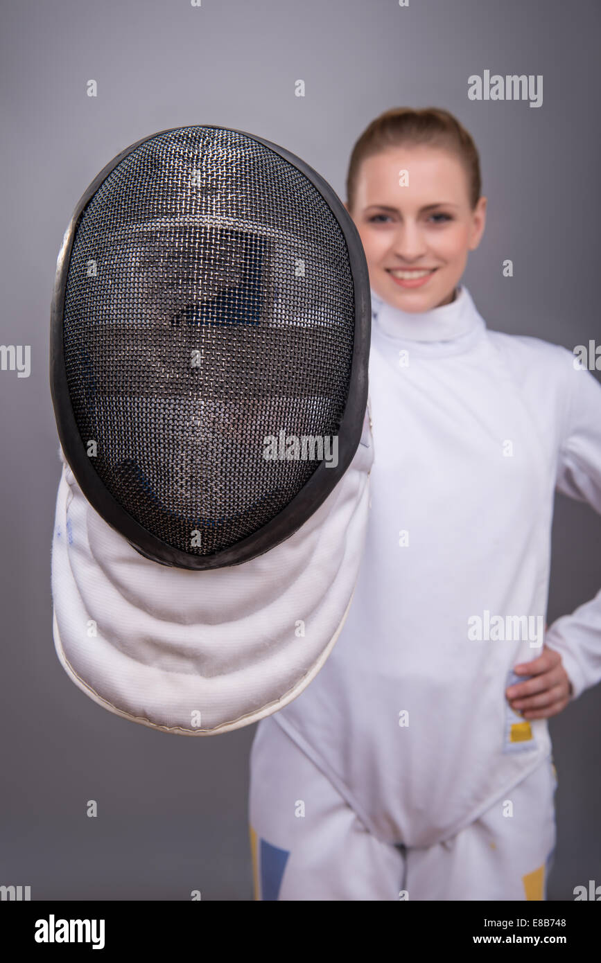 Young woman engaging in fencing Stock Photo - Alamy
