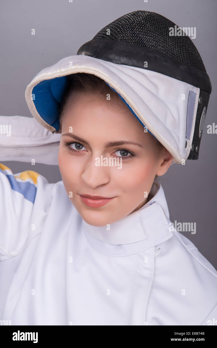 Young woman engaging in fencing Stock Photo - Alamy