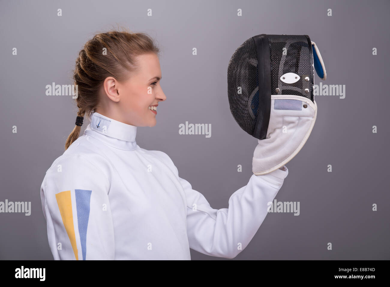 Young woman engaging in fencing Stock Photo - Alamy